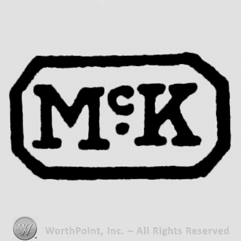Mark with The letters “McK” and a rectangle. | #111100