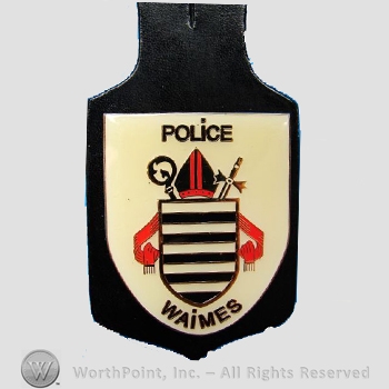 Mark with Heraldry: Black badge encasing a yellow | #499146