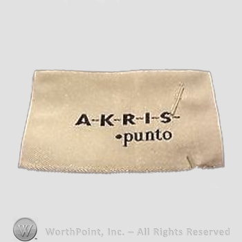 Mark with A label, the word "AKRIS punto" and a | #703319