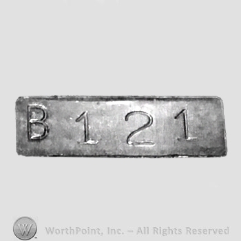 Mark with The text "B 121" on a metal plate. | #730716