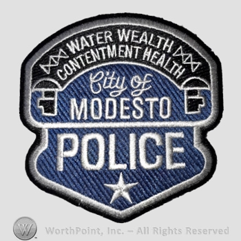 Mark with The text "City of MODESTO, POLICE, | #934766