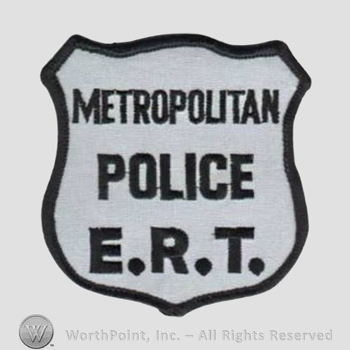 Mark with The text "METROPOLITAN POLICE E.R.T." | #934855