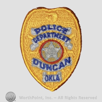 Mark with The text "POLICE DEPARTMENT DUNCAN | #935335