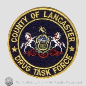 Mark with The text "COUNTY OF LANCASTER DRUG TASK | #935379