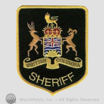 Mark with The text "BRITISH COLUMBIA SHERIFF", a | #941528