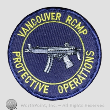 Mark with The text "VANCOUVER RCMP PROTECTIVE | #941555