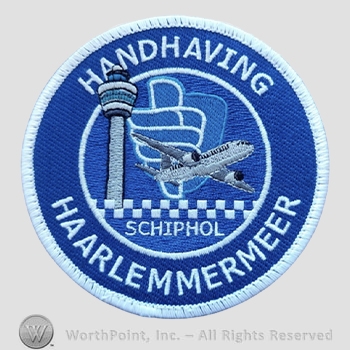 Mark with The text "SCHIPHOL HANDHAVING | #943261